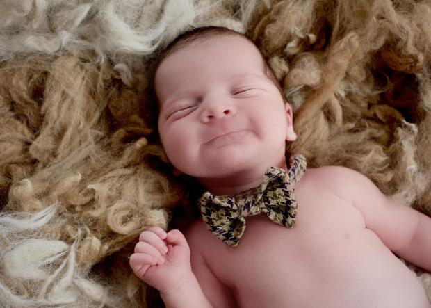 newborn smiling in sleep adorable | Montessori Foundation | Montessori ...
